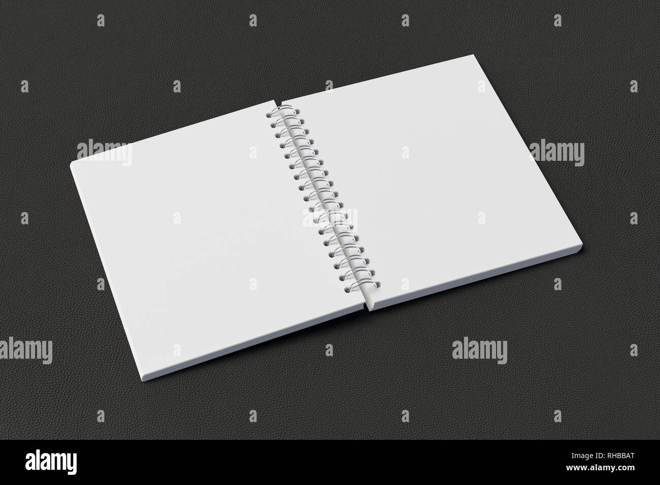 Blank open vertical spiral notepad on black background. With clipping ...