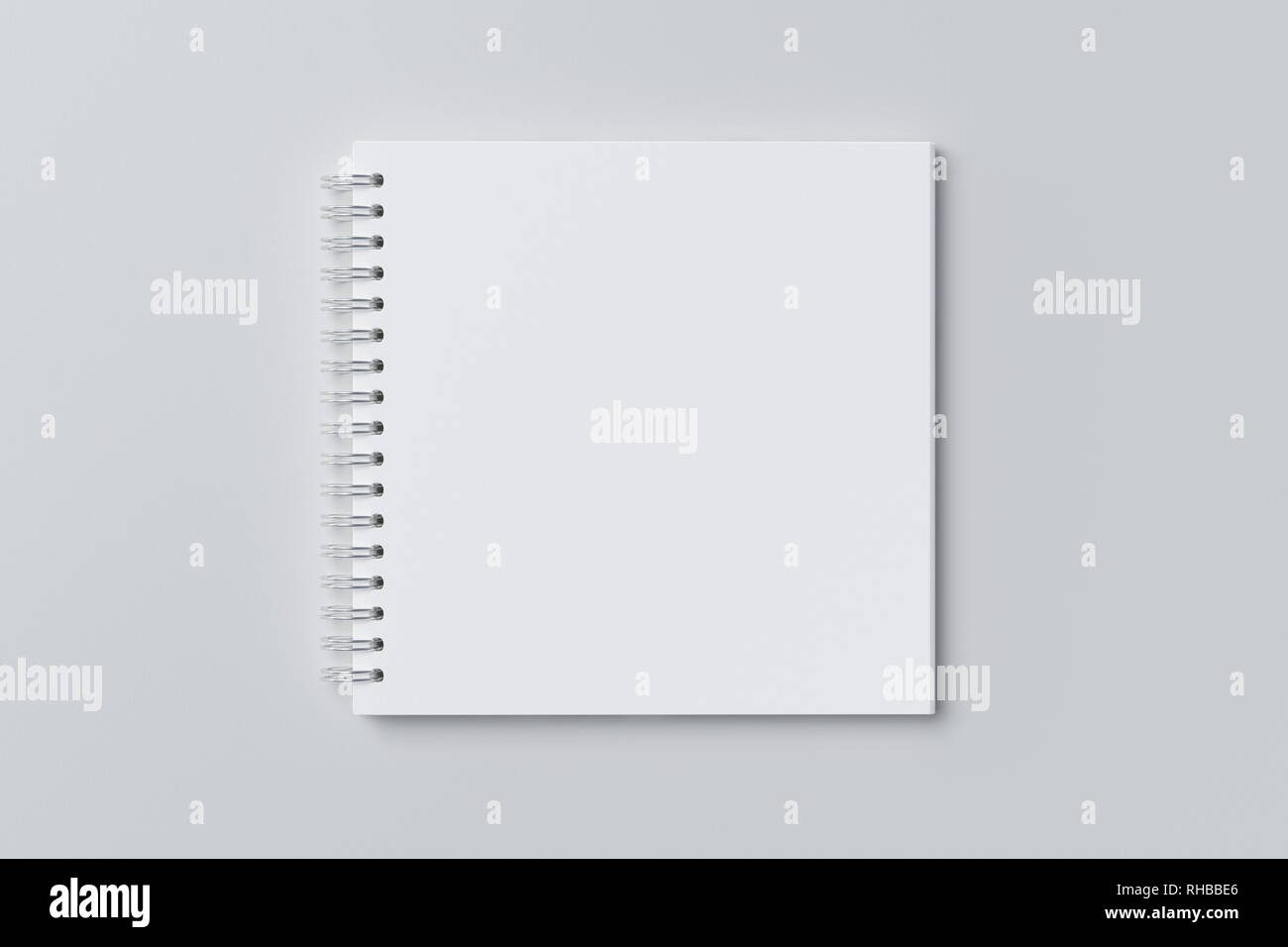 Blank square spiral notepad on white background. With clipping path ...