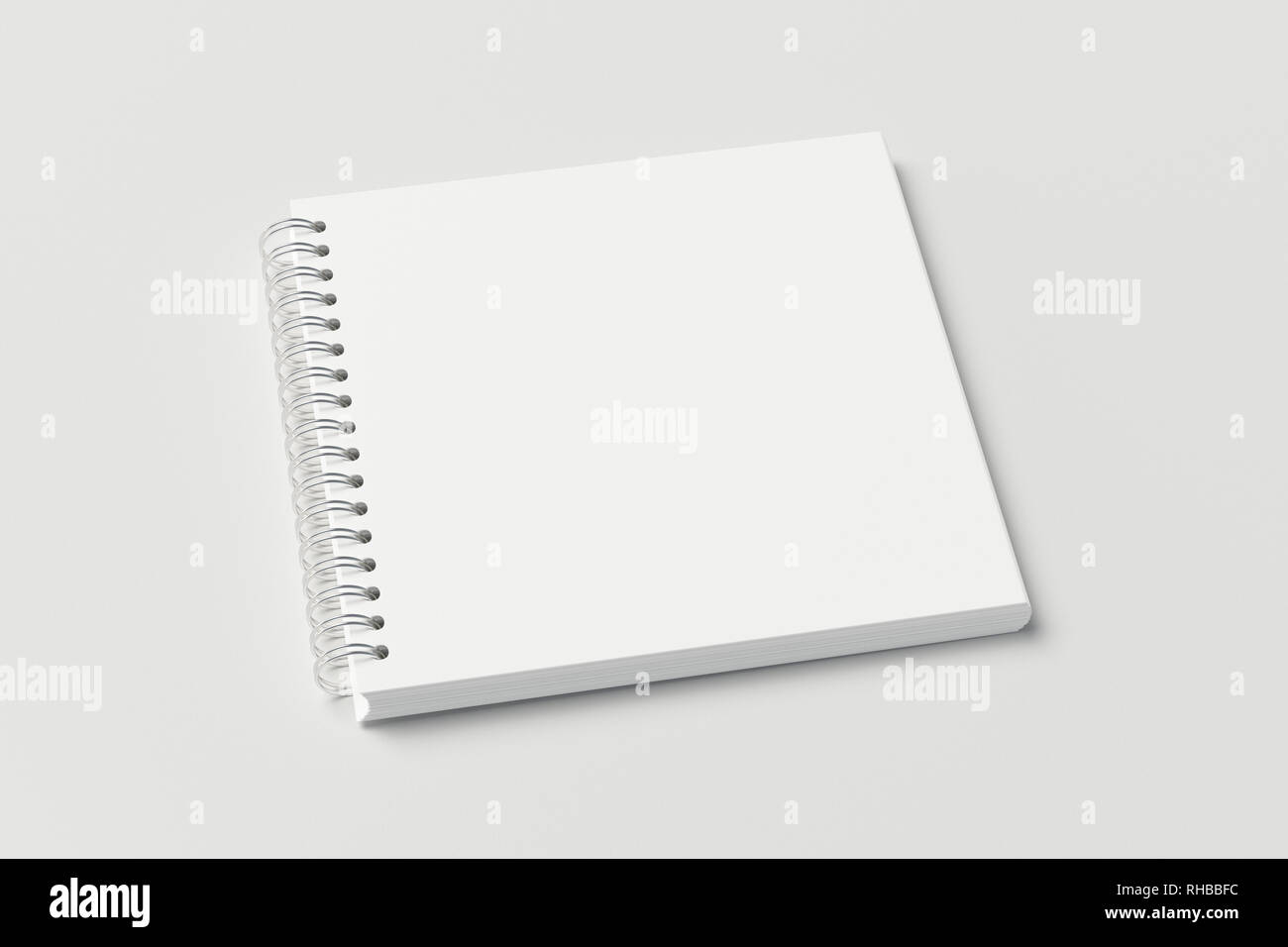 Blank square spiral notepad on white background. With clipping path ...
