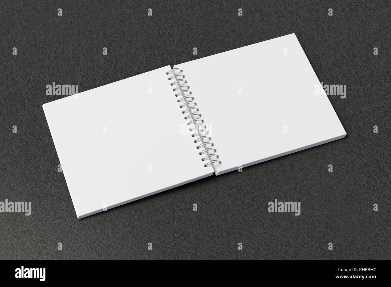 Blank open square spiral notepad on black background. With clipping ...