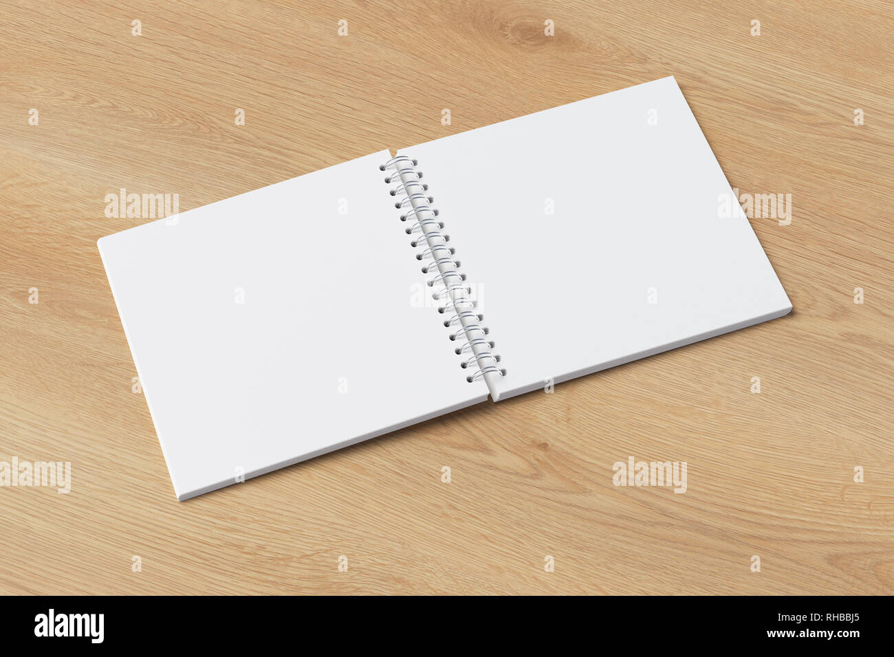 Blank open square spiral notepad on wooden background. With clipping ...