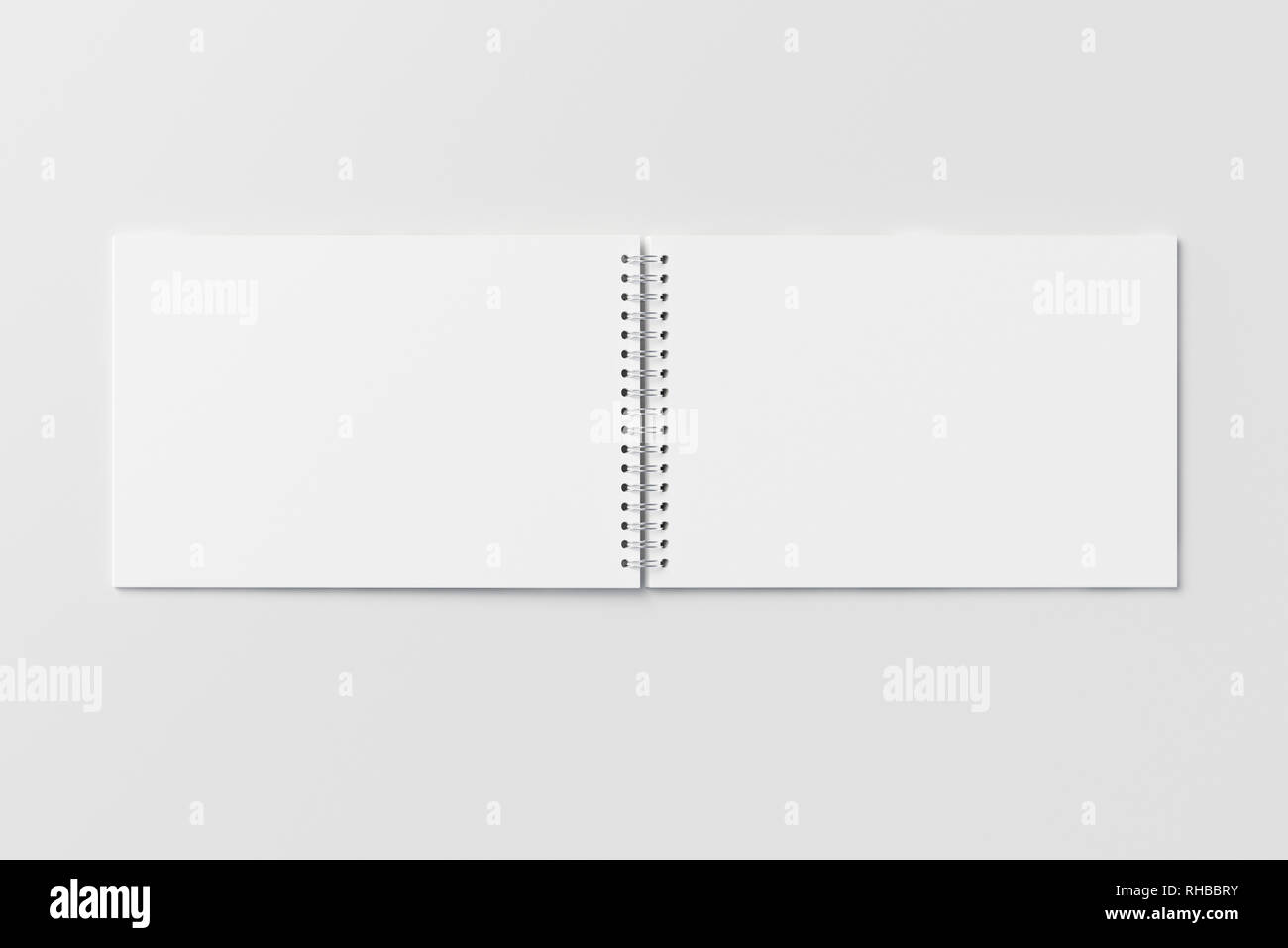 Blank open horizontal spiral notepad on white background. With clipping ...