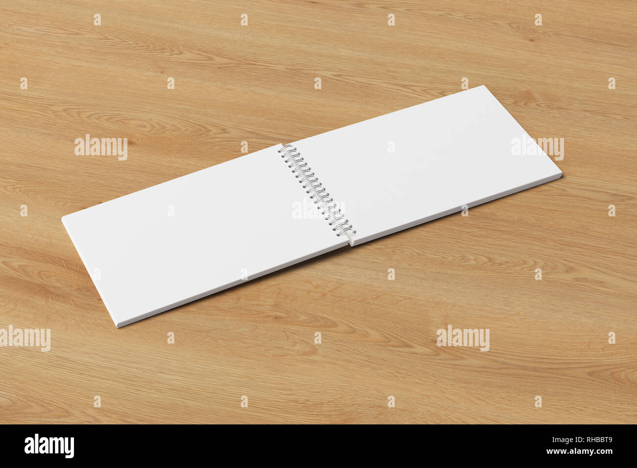Blank open horizontal spiral notepad on wooden background. With ...