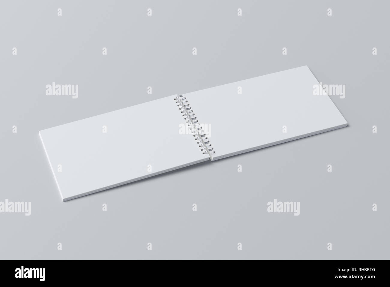 Blank open horizontal spiral notepad on white background. With clipping ...