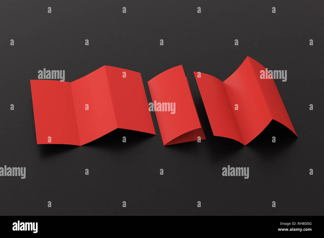 Blank red trifold paper leaflet on black background. Six pages, three ...