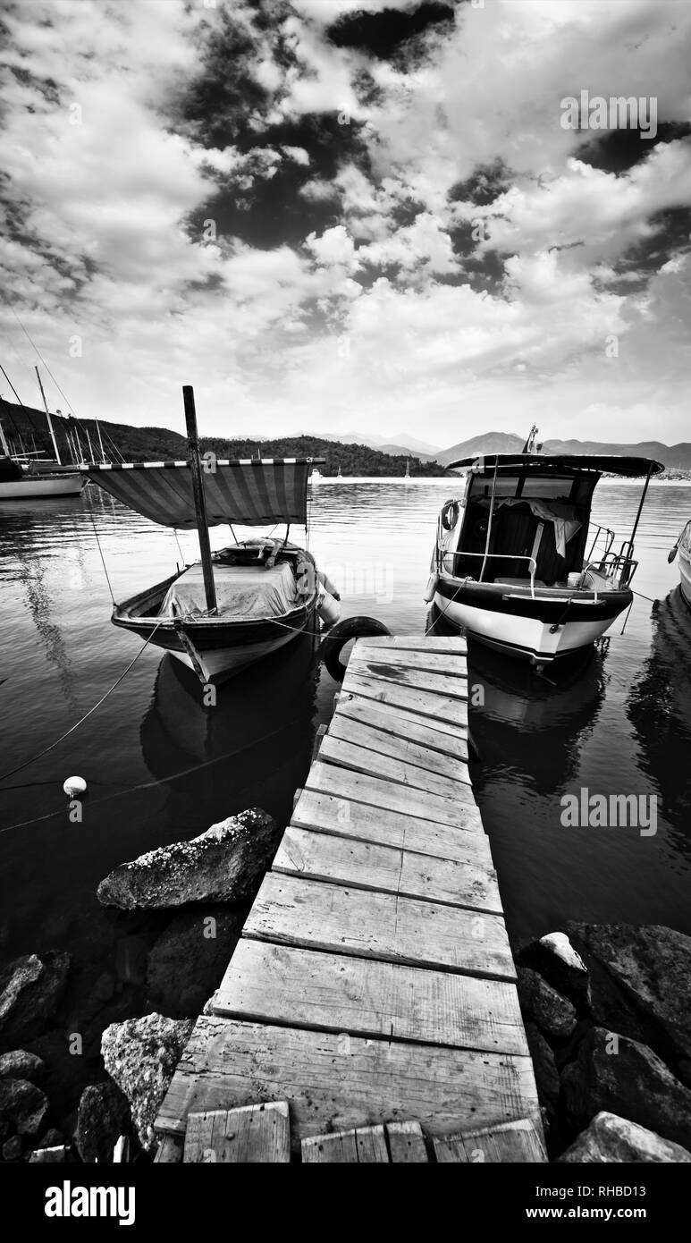 Wooden pier with boat hi-res stock photography and images - Alamy