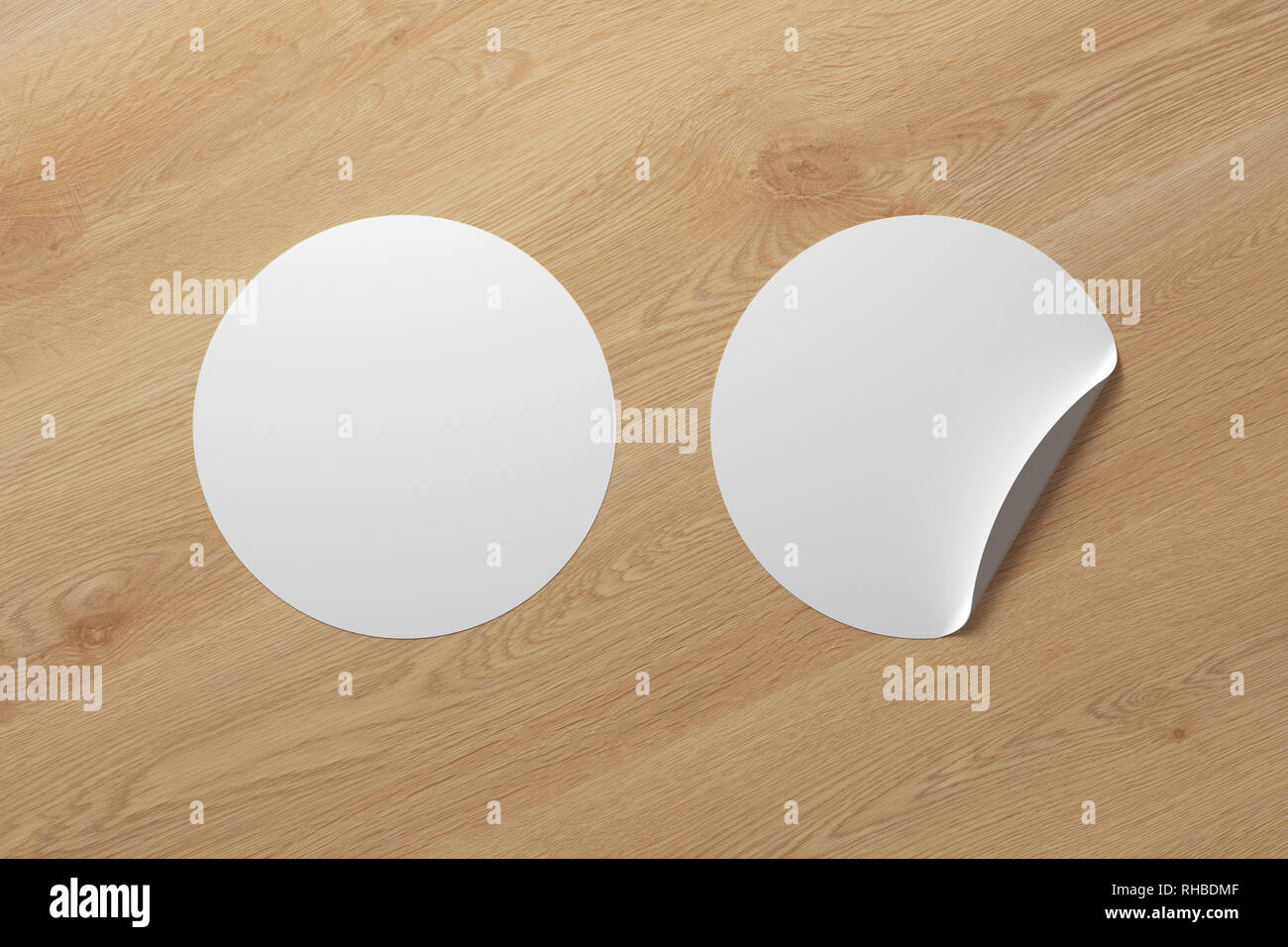 Blank white round stickers straightened and with folded corner on ...