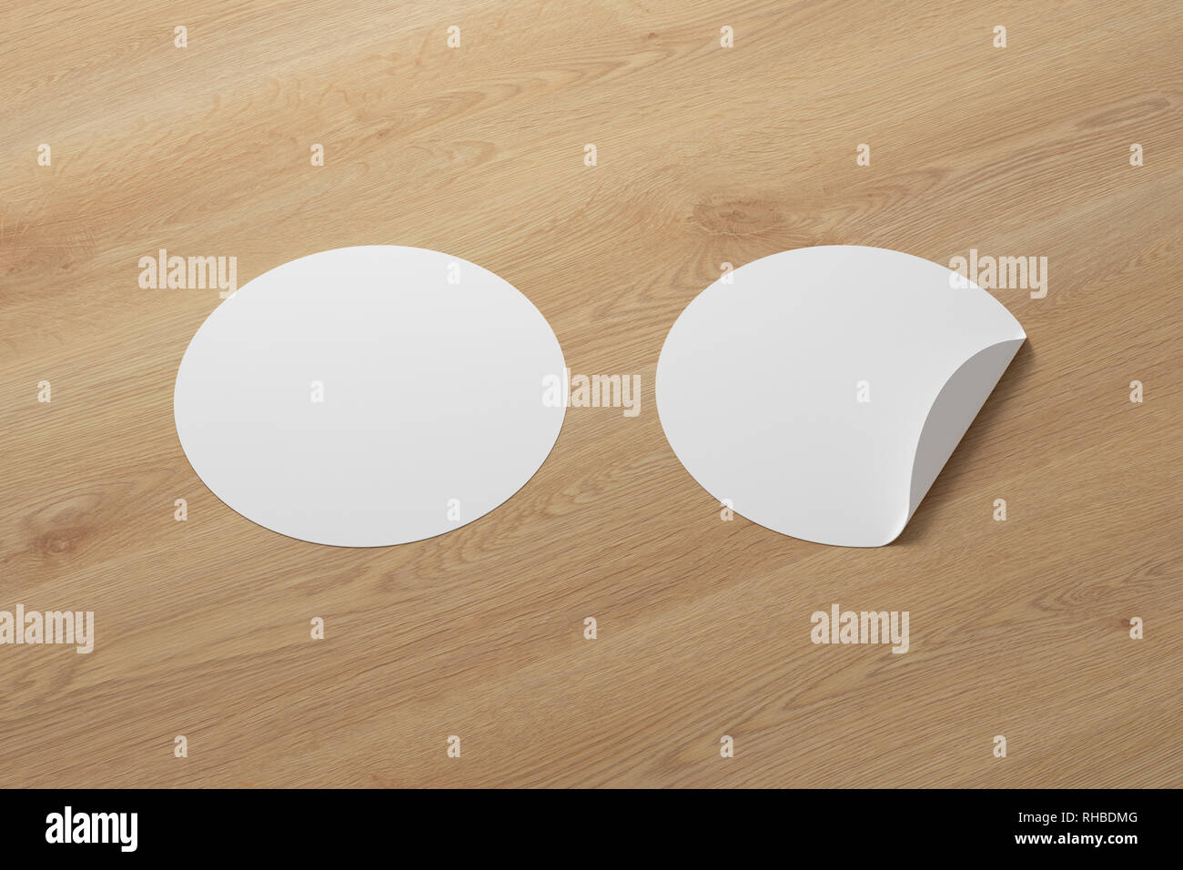Blank white round stickers straightened and with folded corner on ...