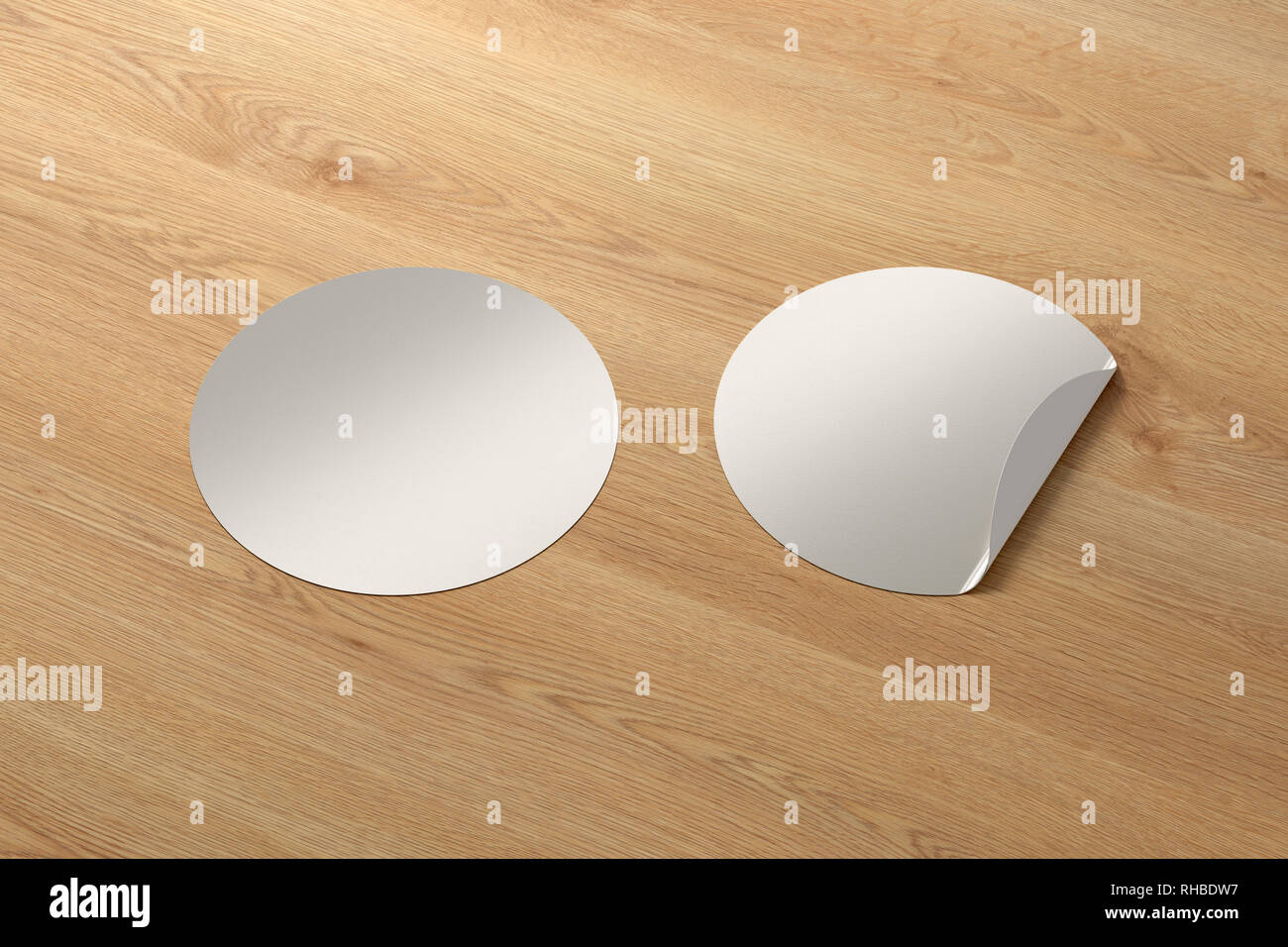 Blank silver round stickers straightened and with folded corner on ...