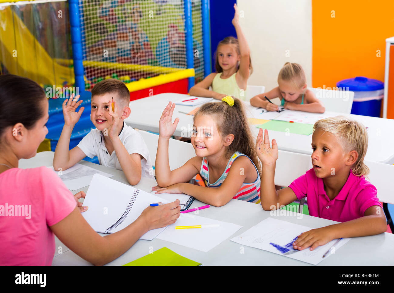 little children sitting together and studying in class at school Stock ...