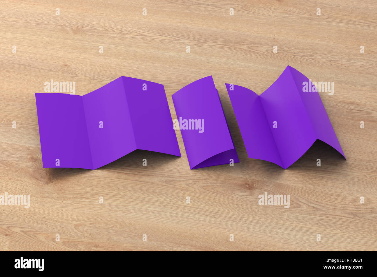 Blank violet trifold paper leaflet on wooden background. Six pages, three panel Stock Photo - Alamy