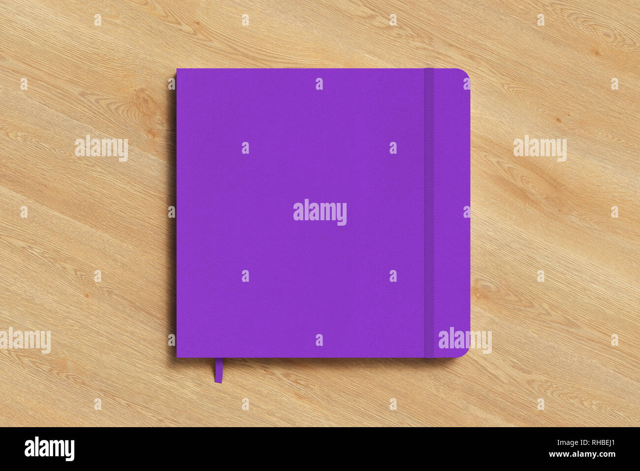 Violet square notebook with elastic band on wooden background Stock ...
