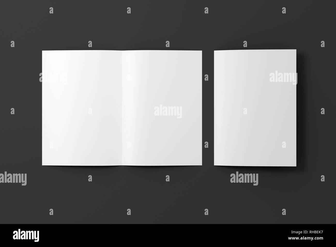 Blank white open and folded half-folded flyer leaflet on black ...