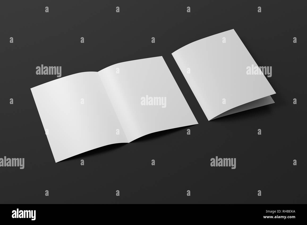 Blank white open and folded half-folded flyer leaflet on black ...
