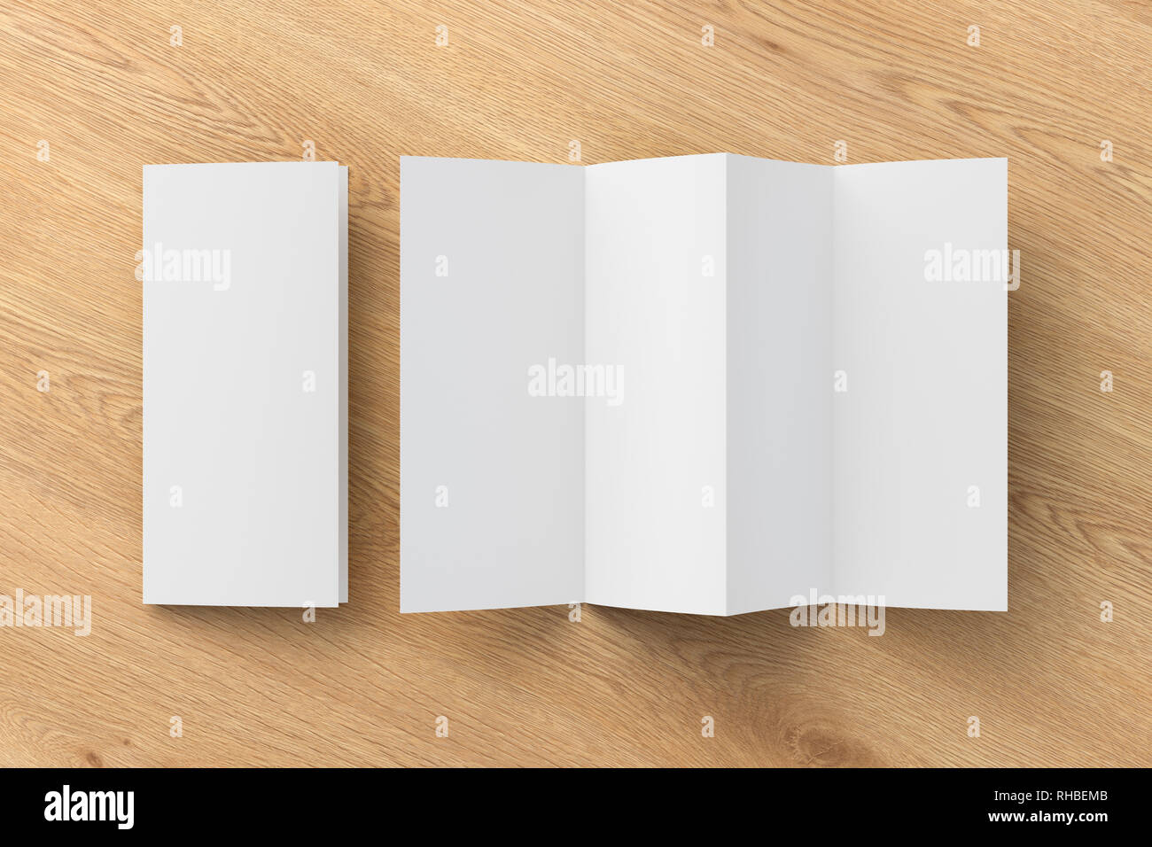 Blank folded paper leaflet on wooden background. Eight pages, four ...