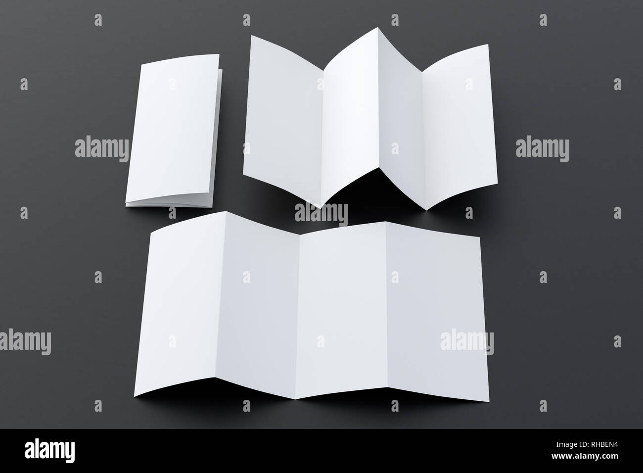 Blank folded paper leaflet on black background. Eight pages, four panel ...