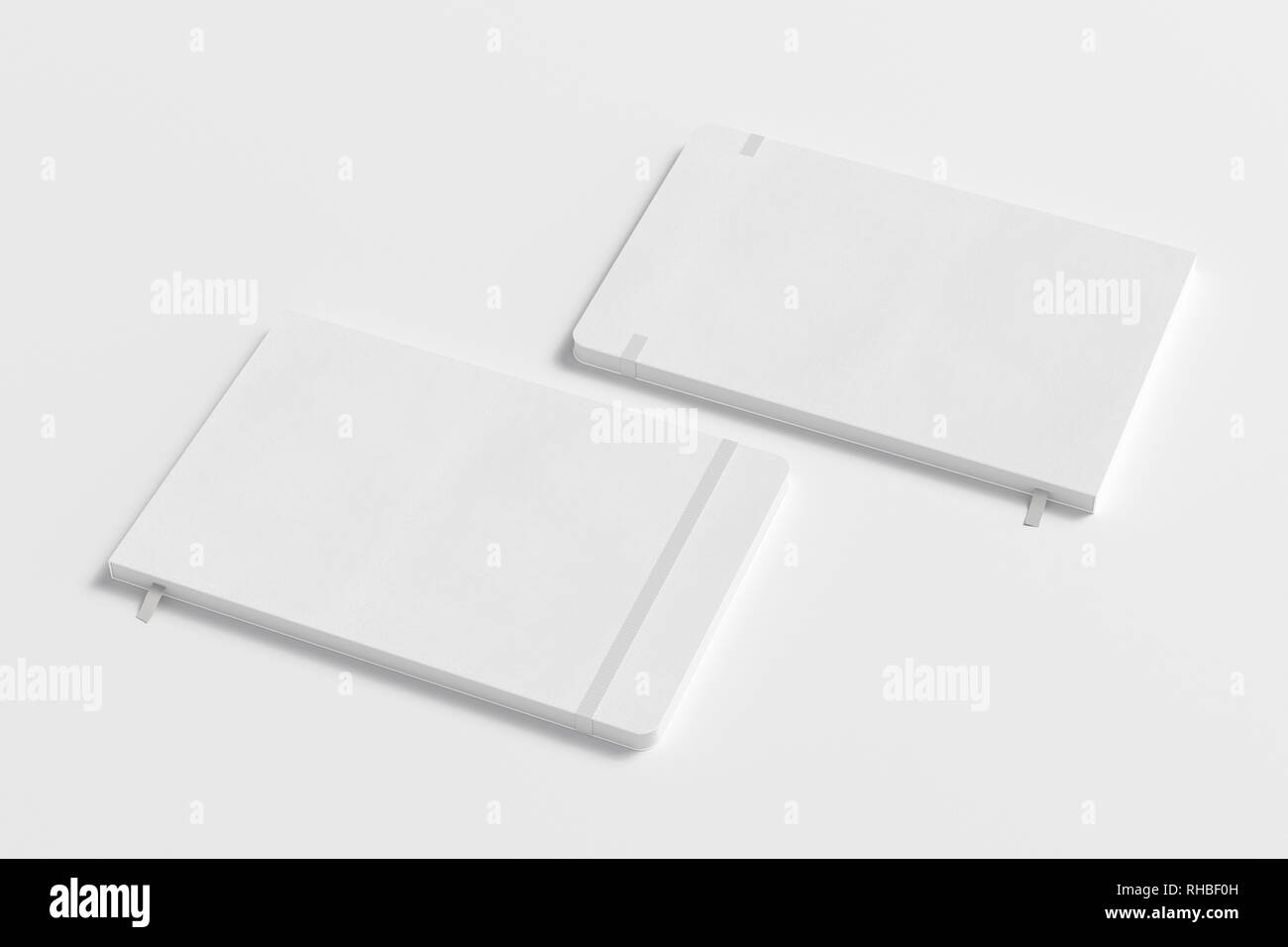 White horizontal notebook with elastic band on white background. Front ...