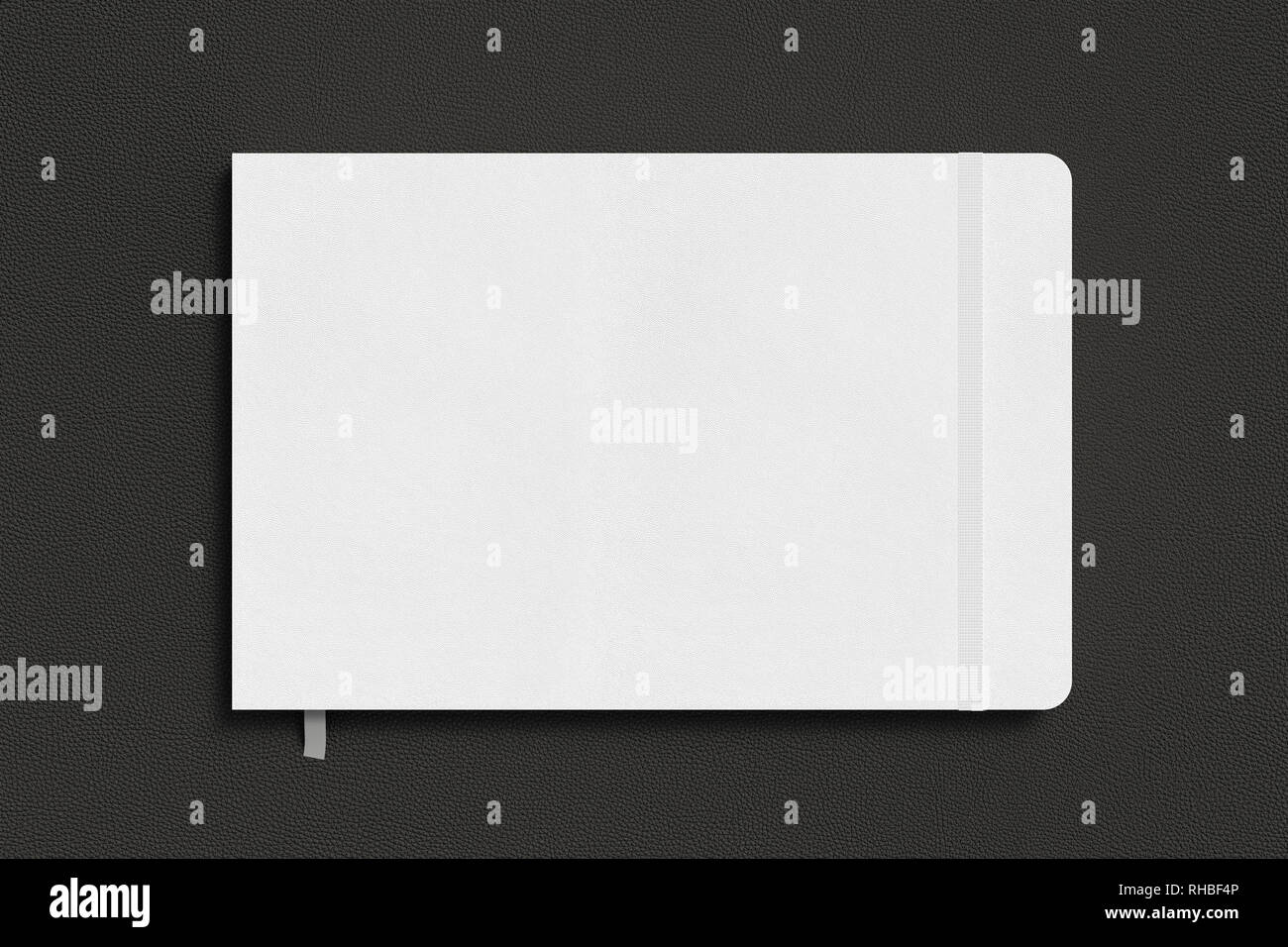 White horizontal notebook with elastic band on black background Stock ...