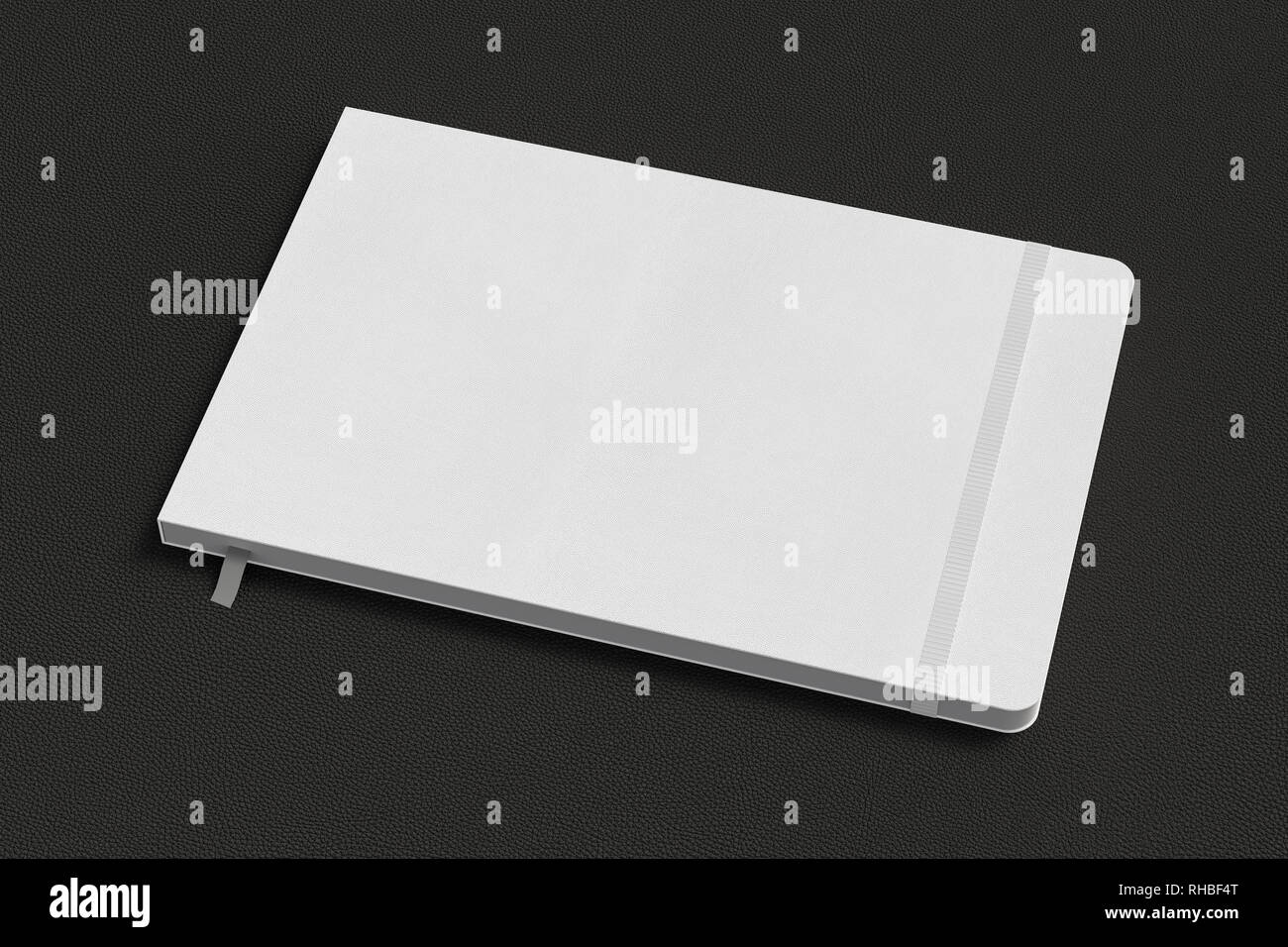 White horizontal notebook with elastic band on black background Stock ...