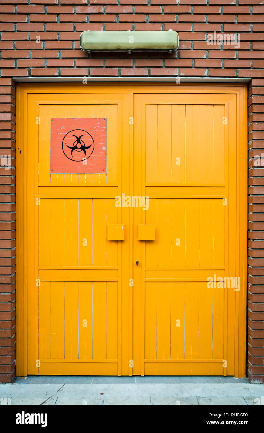 Yellow Door and Biohazard Symbol Stock Photo - Alamy