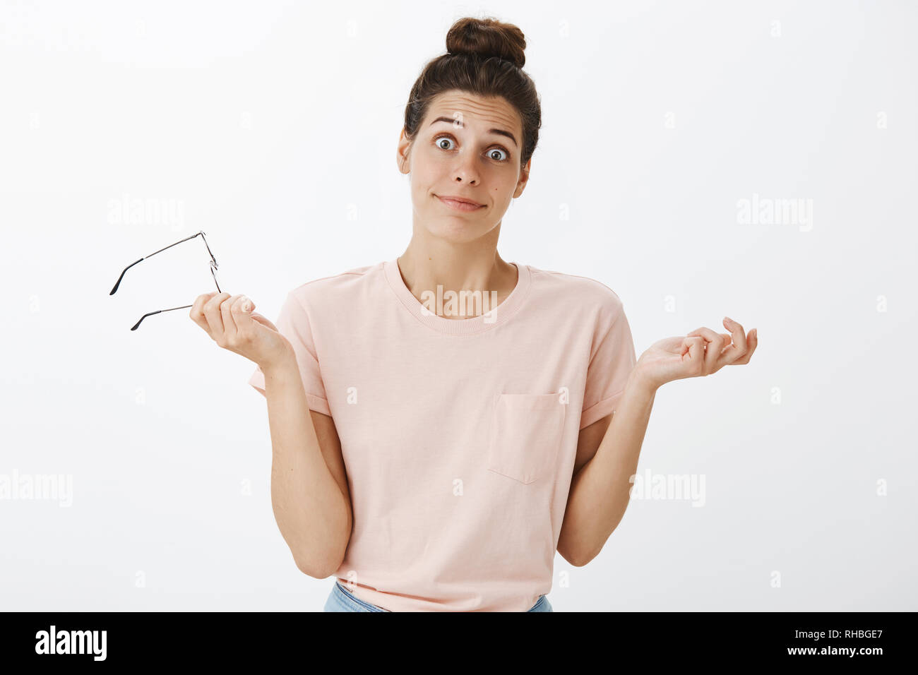 Waist-up shot of carefree indifferent and unbothered female coworker ...