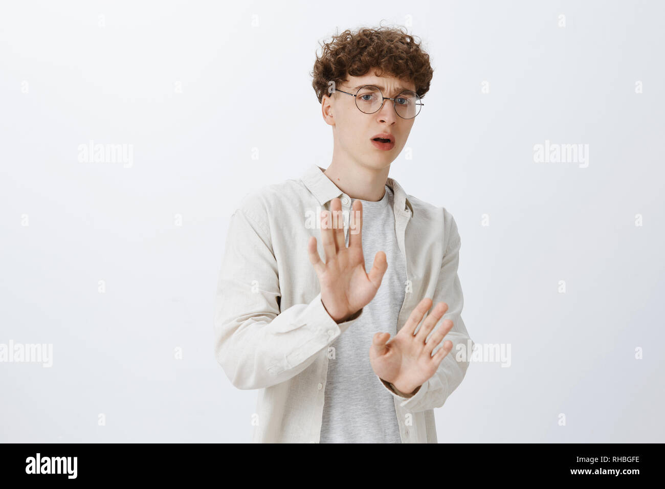 Guy begging bullies not beat him raising hands in surrender trying ...