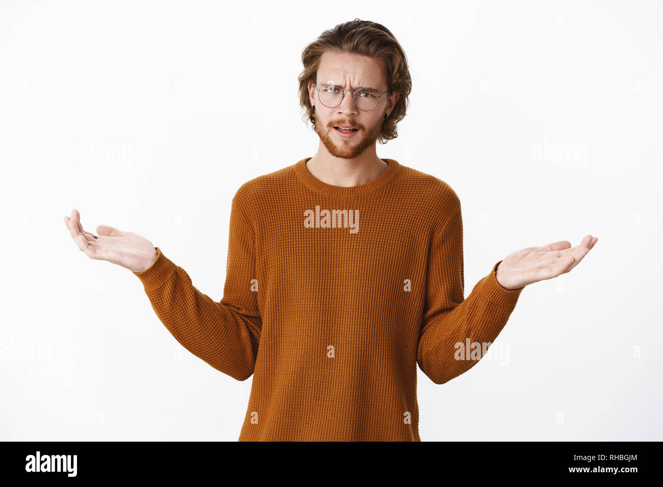 Man looking confused hands up hi-res stock photography and images - Alamy