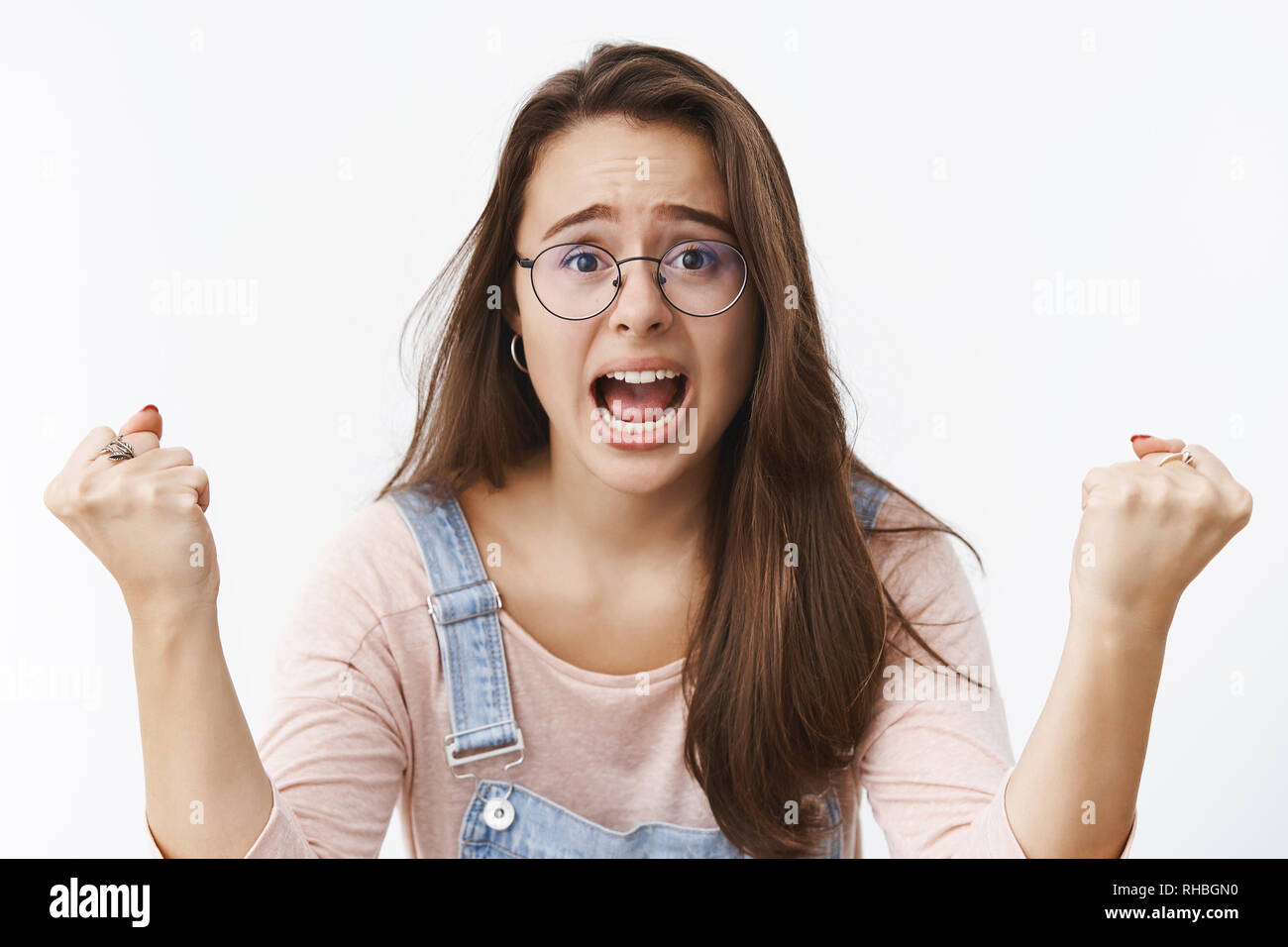 Cheerful excited and energized woman yelling in cheer and support ...