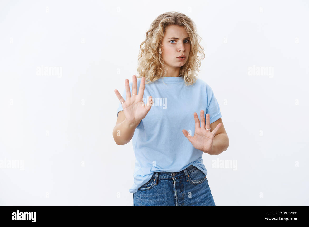 Wow slow down. Intense and concerned woman breathing heavy raising ...