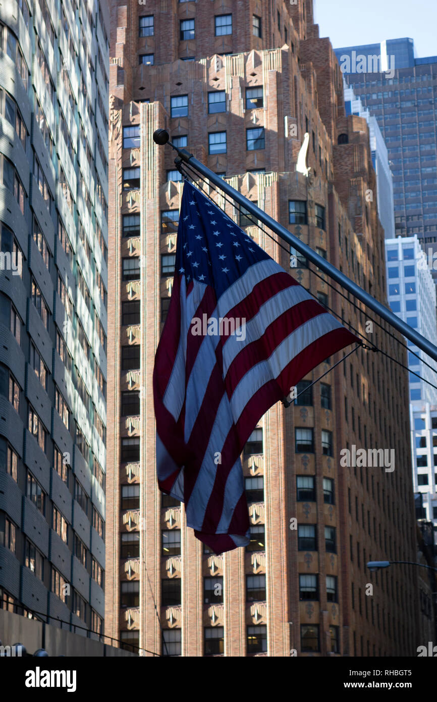 American flag in front of city buildings Stock Photo - Alamy