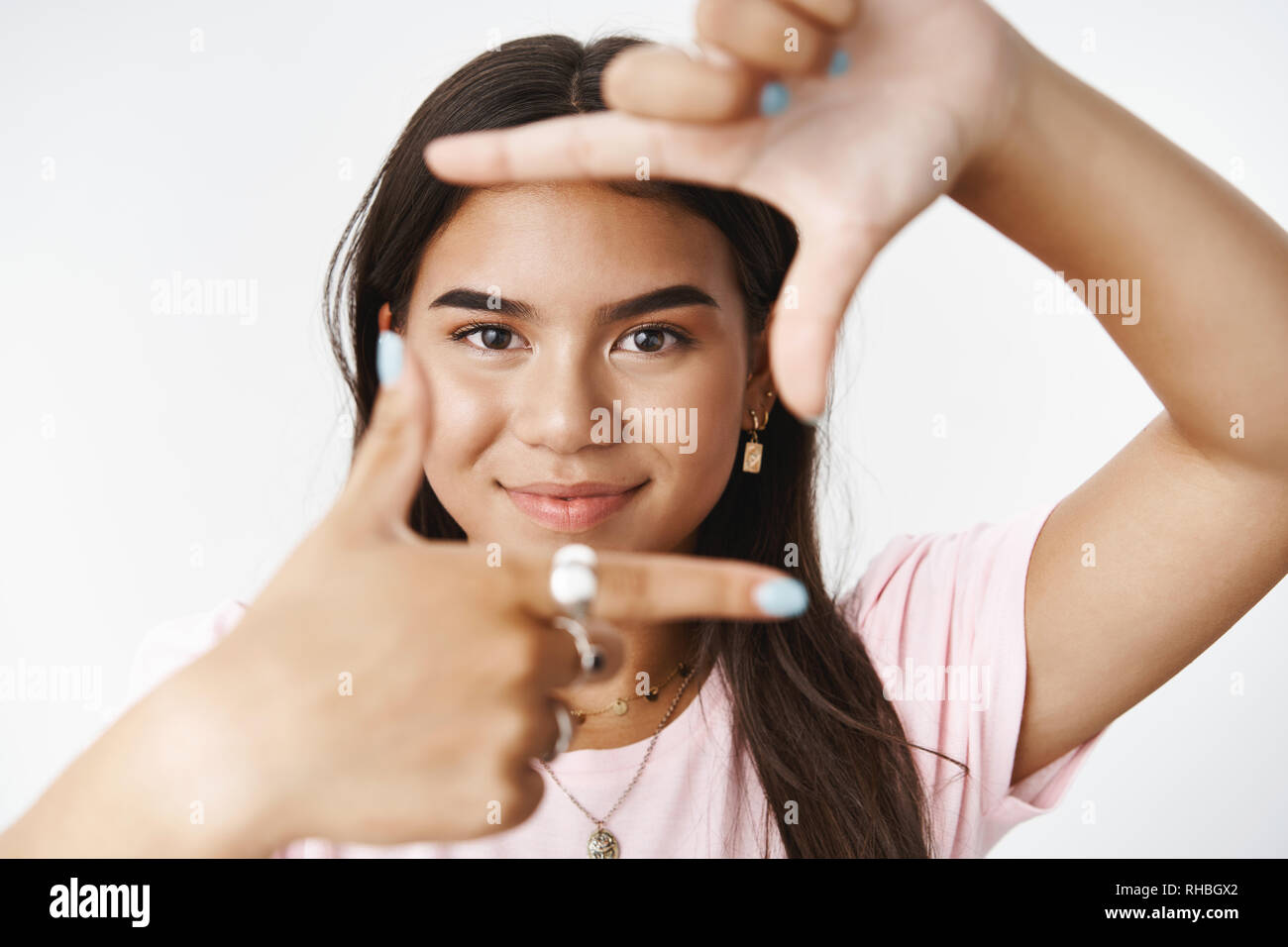 Close-up shot of imaginative and creative good-looking indian girl ...