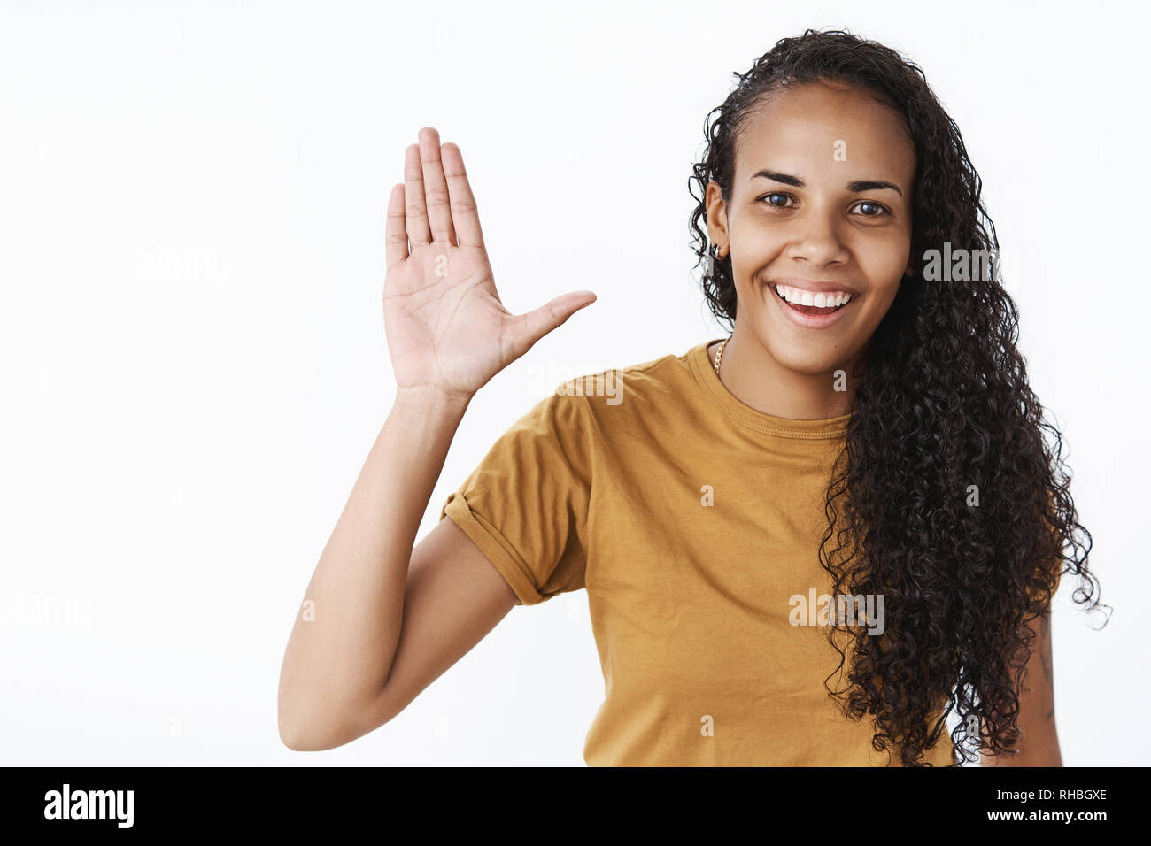 Hey high five mate. Portrait of friendly and outgoing nice attractive ...