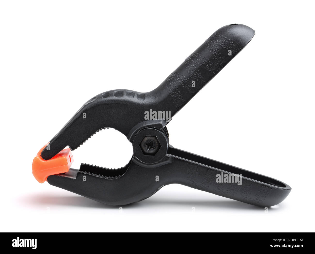 Black plastic spring clamp isolated on white Stock Photo - Alamy