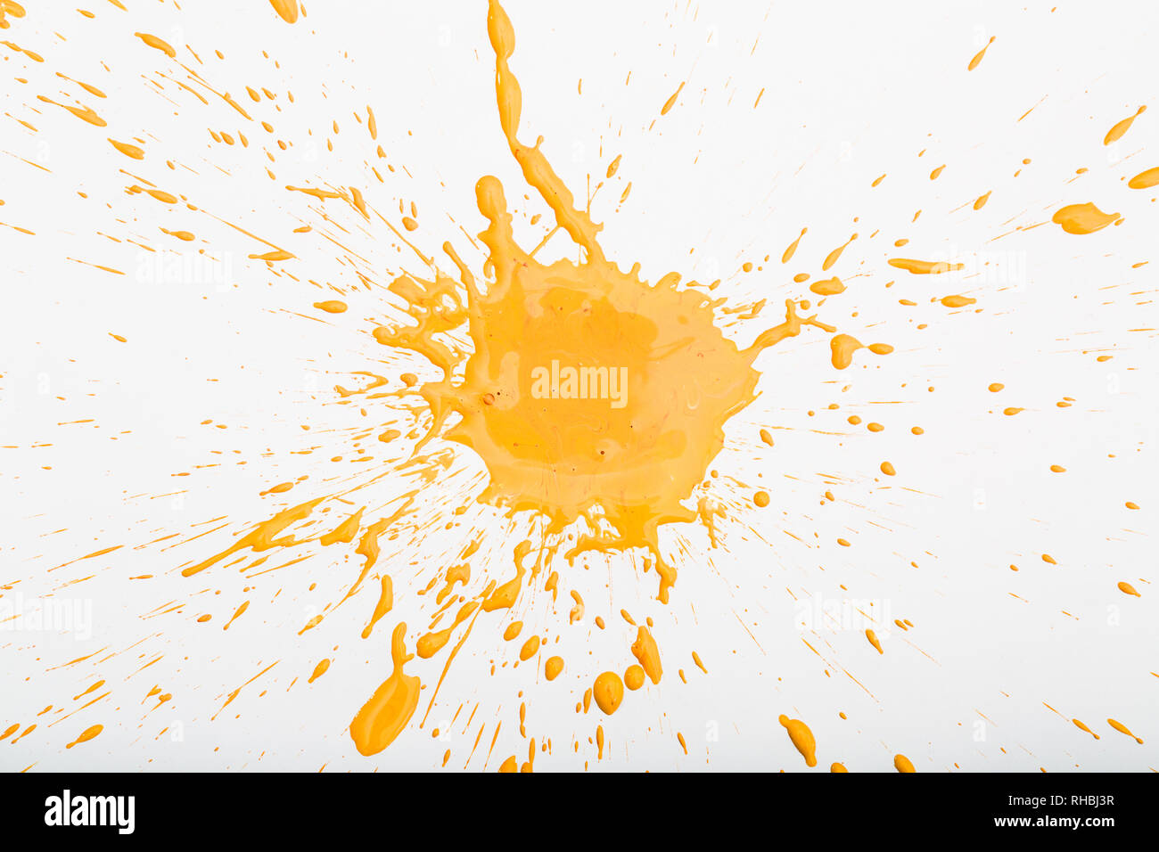 Deep yellow paint spot isolated on white background Stock Photo - Alamy