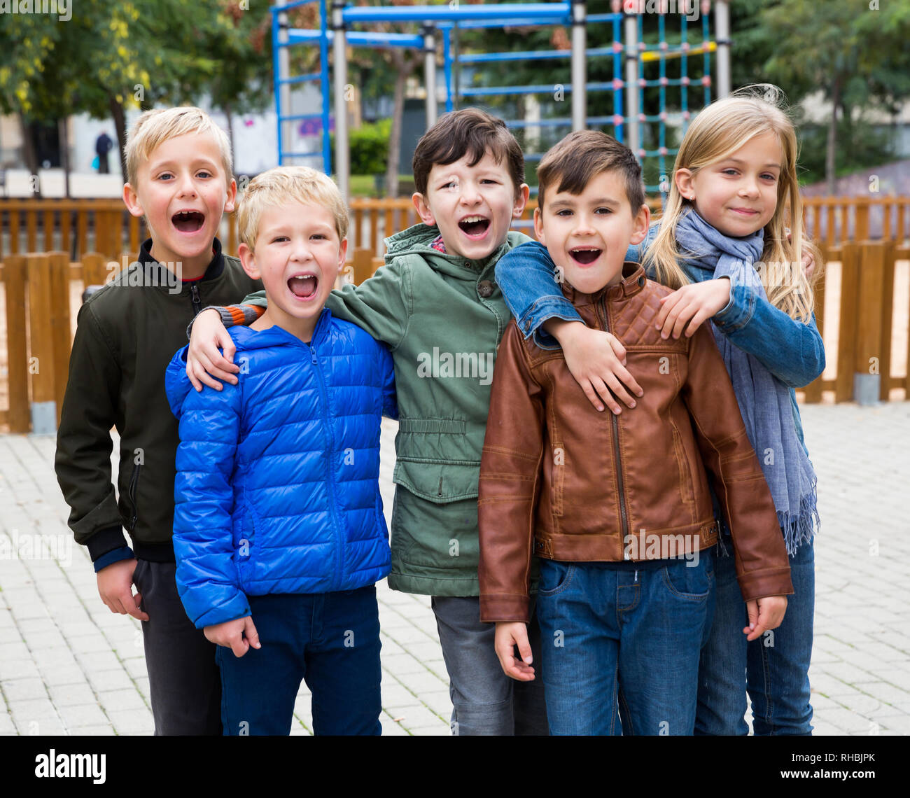 Five little friends posing on the playground Stock Photo - Alamy