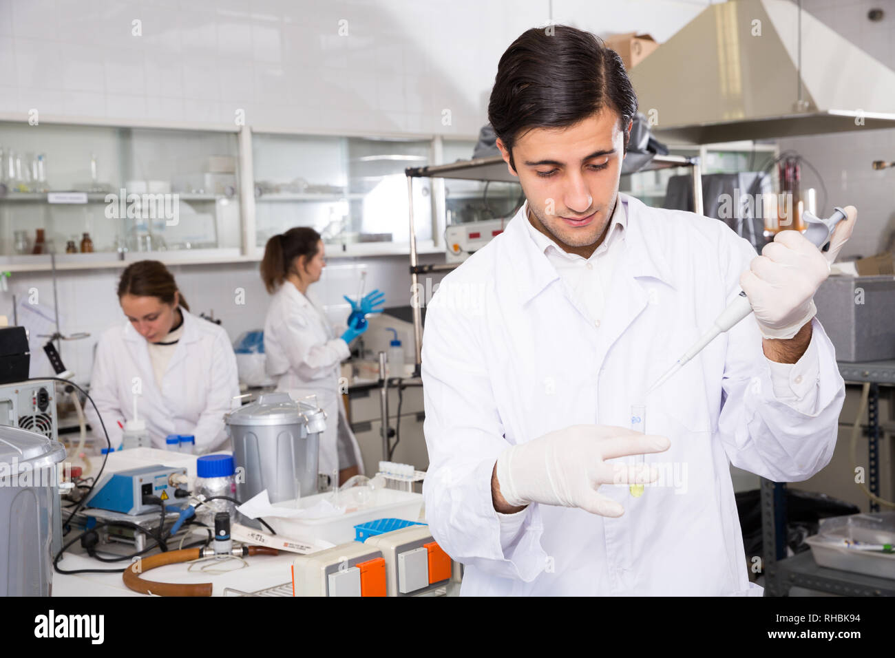 Intelligent student performing experiments in university laboratory ...