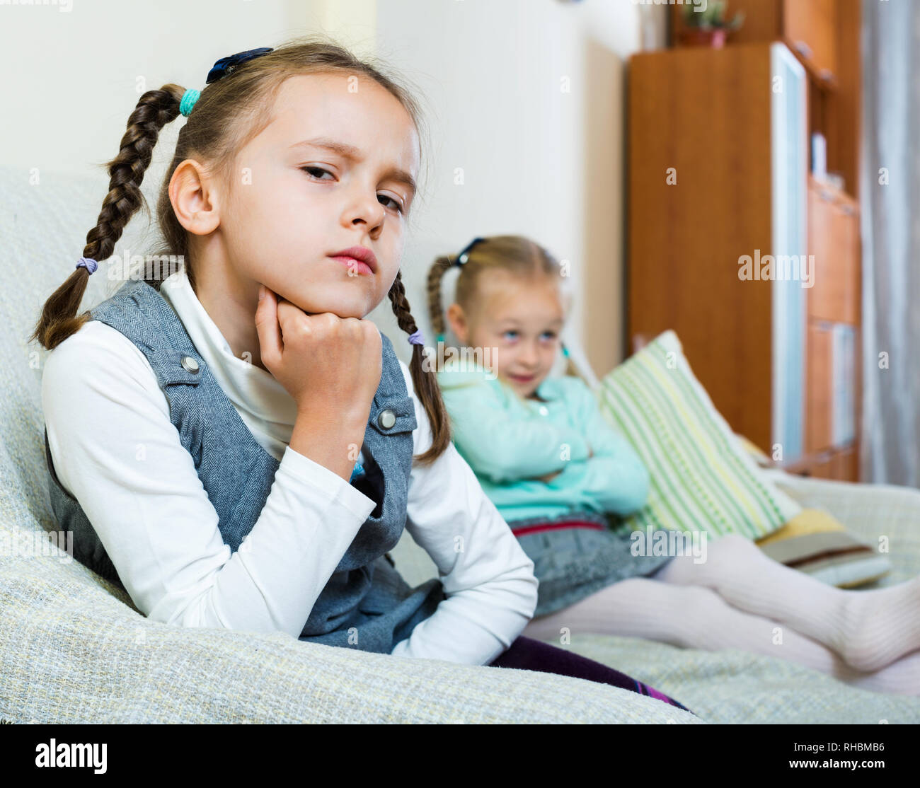 Portrait of two little miserable girls having conflict at home Stock ...