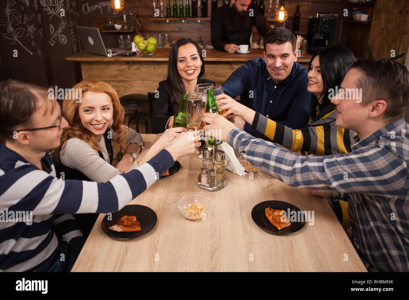 Person making a toast to group hi-res stock photography and images - Alamy