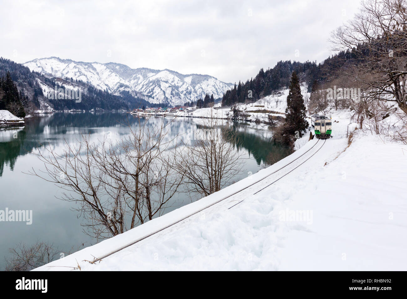 Train in Winter landscape snow on bridge Stock Photo - Alamy
