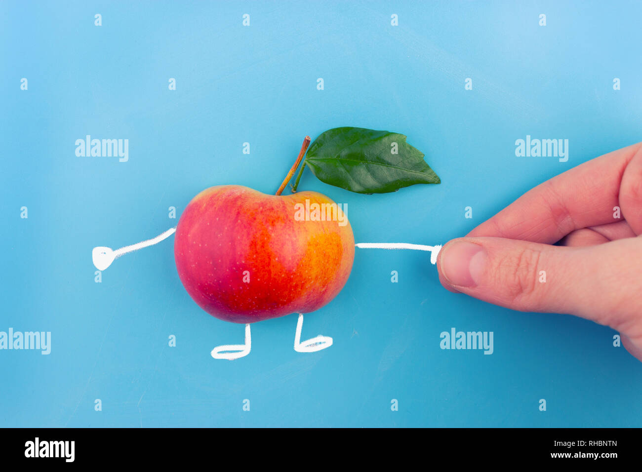 Funny apple character. apple holding hands with human Stock Photo - Alamy