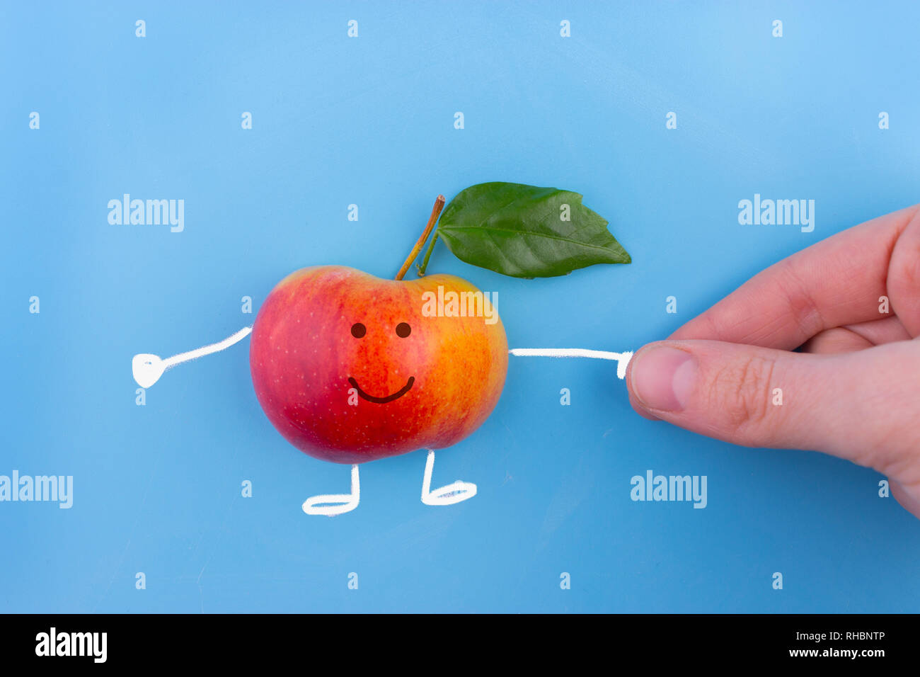 Funny apple character. apple holding hands with human Stock Photo - Alamy