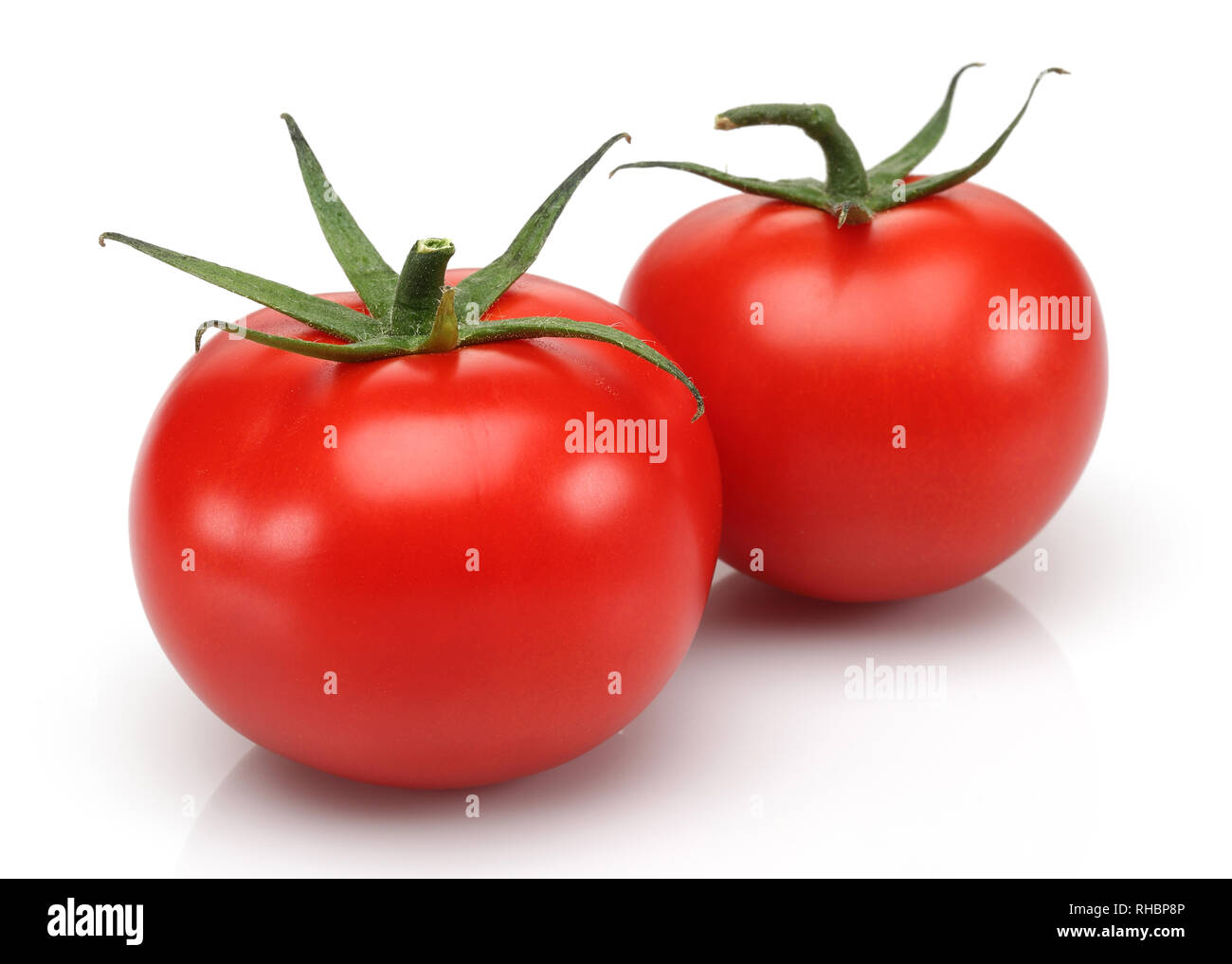 Fresh whole tomatoes isolated on white background Stock Photo - Alamy