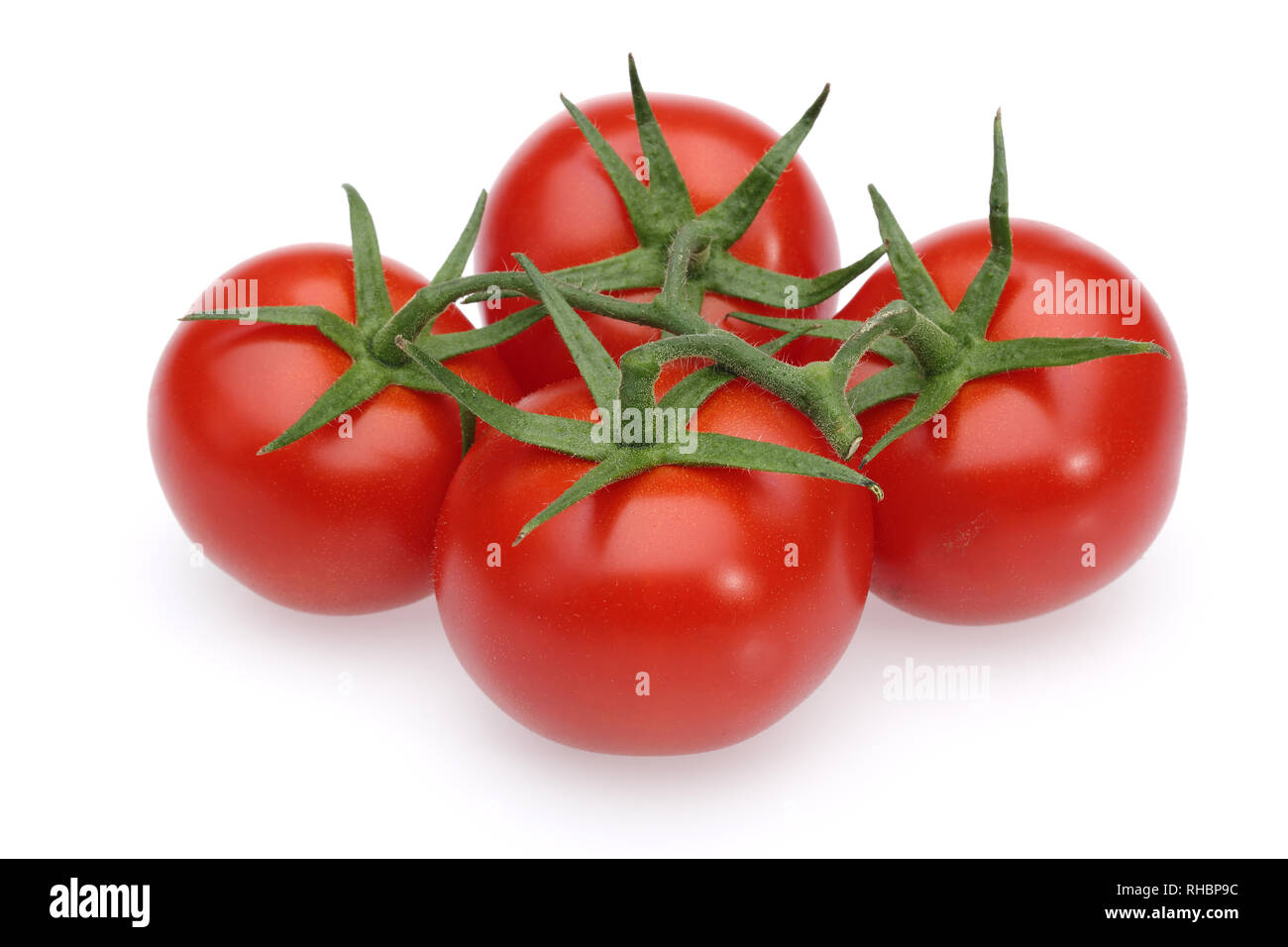 Fresh whole tomatoes isolated on white background Stock Photo - Alamy