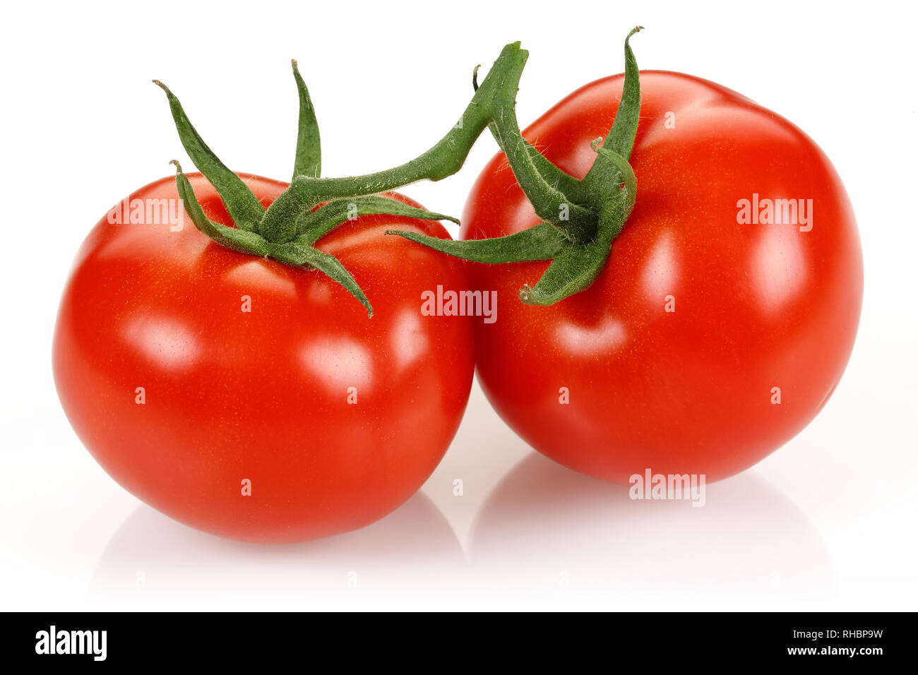 Fresh whole tomatoes isolated on white background Stock Photo - Alamy