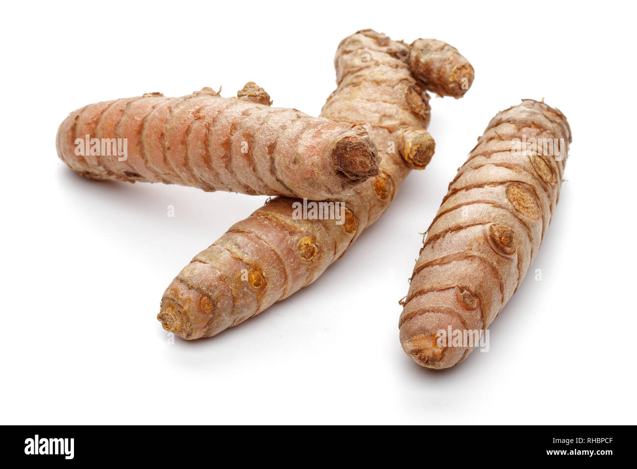 Fresh whole turmeric isolated on white background Stock Photo - Alamy
