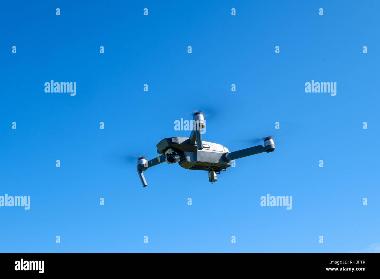 Folding drone flying in a sky Stock Photo - Alamy