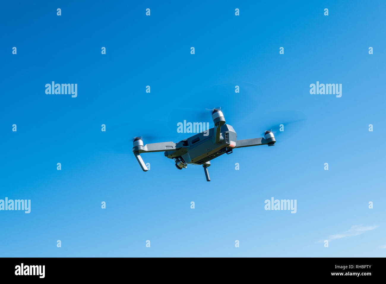Folding drone flying in a sky Stock Photo - Alamy