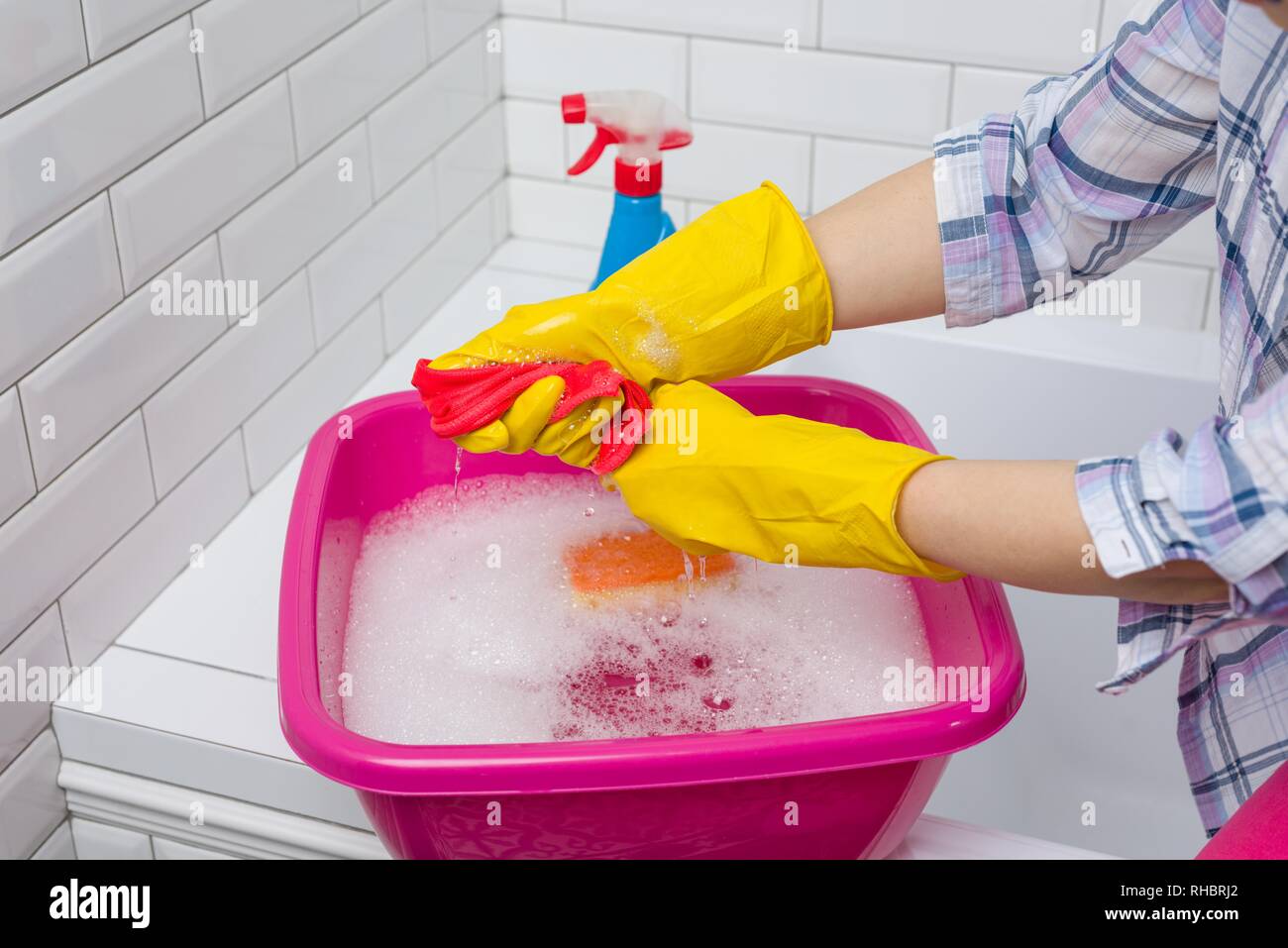 House cleaning. Woman is cleaning in the bathroom at home Stock Photo ...