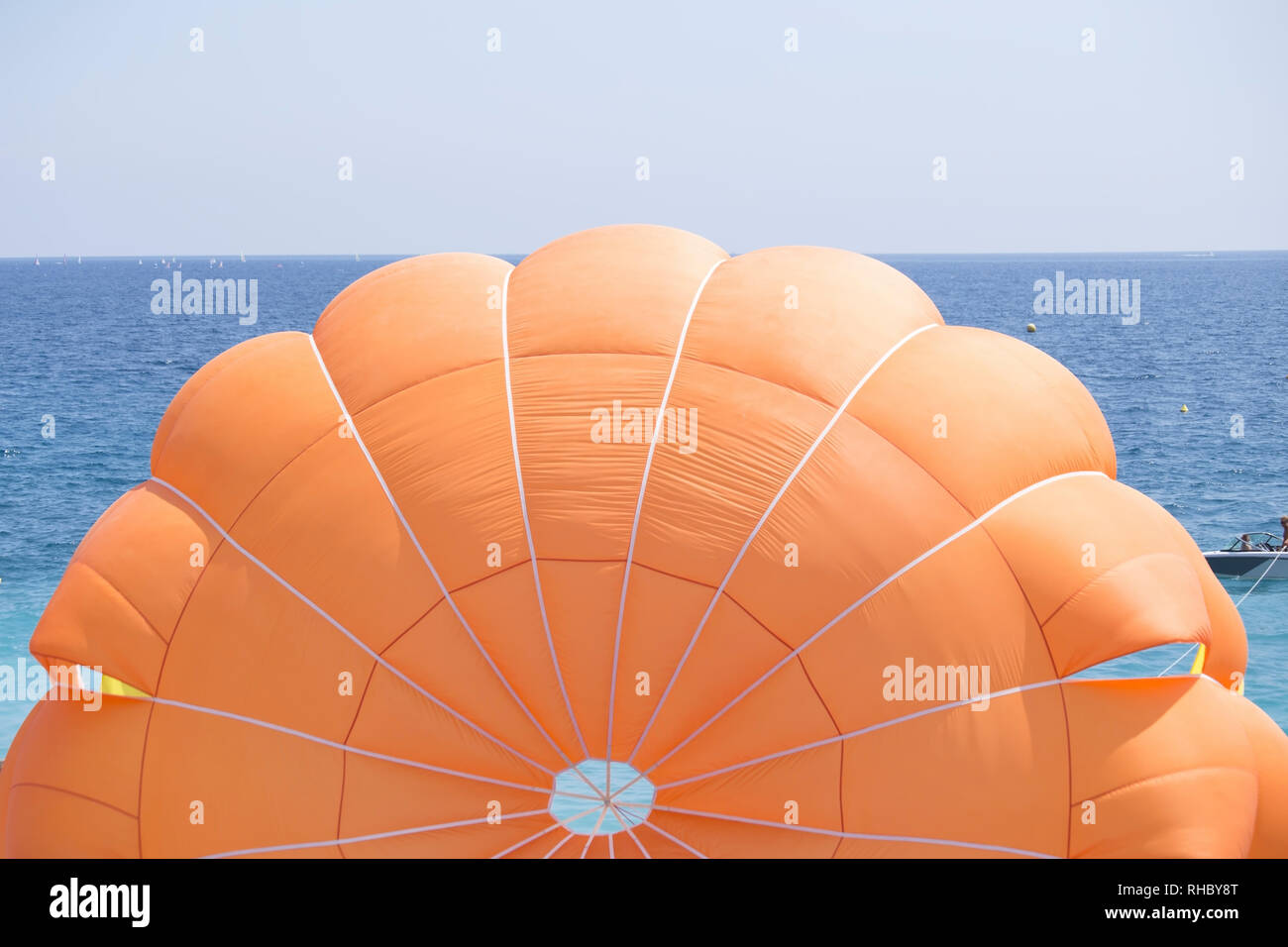 Orange parachute on the Nice beach Stock Photo - Alamy