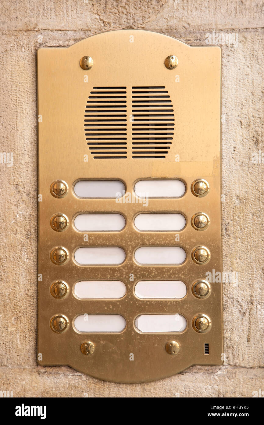 Brass intercom on a marble facade Stock Photo - Alamy